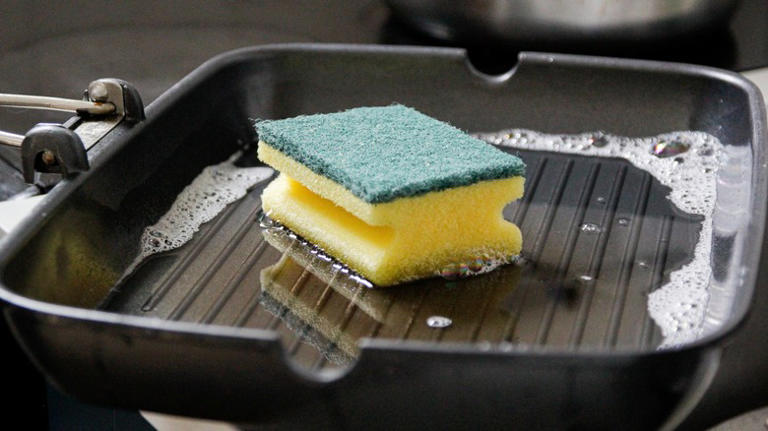 Why You Need To Snip Off Just One Corner Of Your Kitchen Sponge
