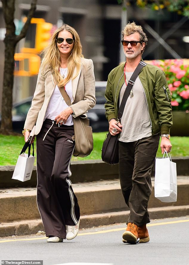 Elle Macpherson's hair extensions are exposed as she heads out with her ...