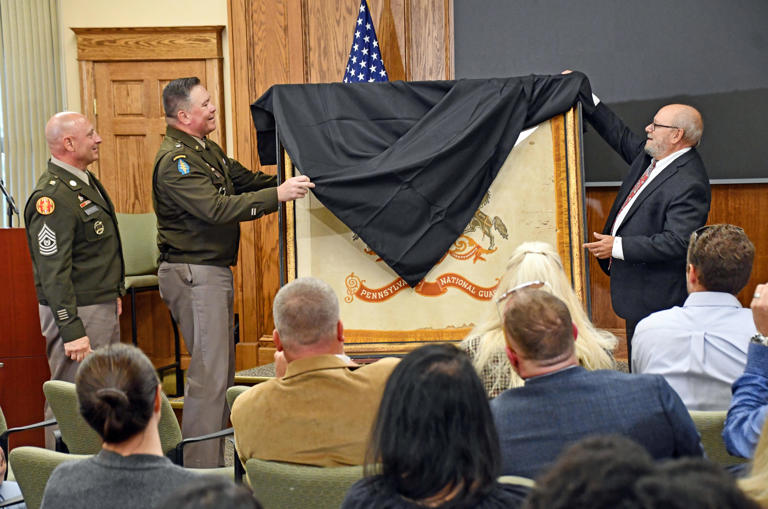 'Colors of a unit': Historic 1920s National Guard flag returned to Fort ...