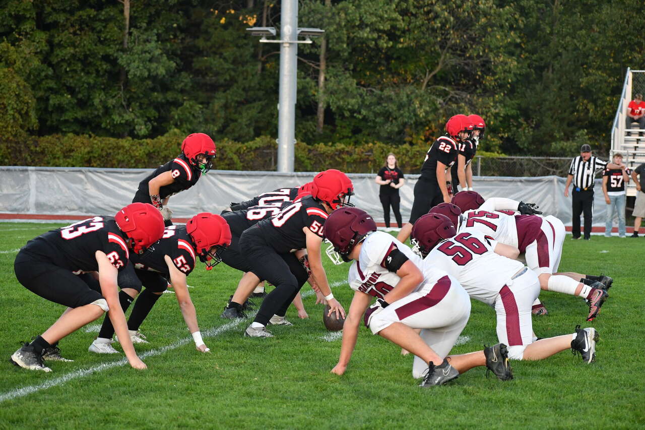 2 football teams face off wearing special Guardian Caps, a 1st for the area