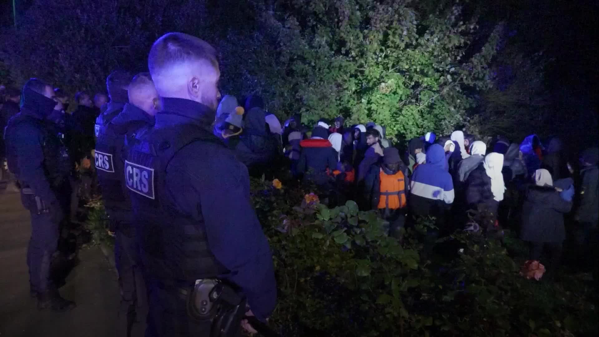 Riot police stop migrants from reaching beach in French town