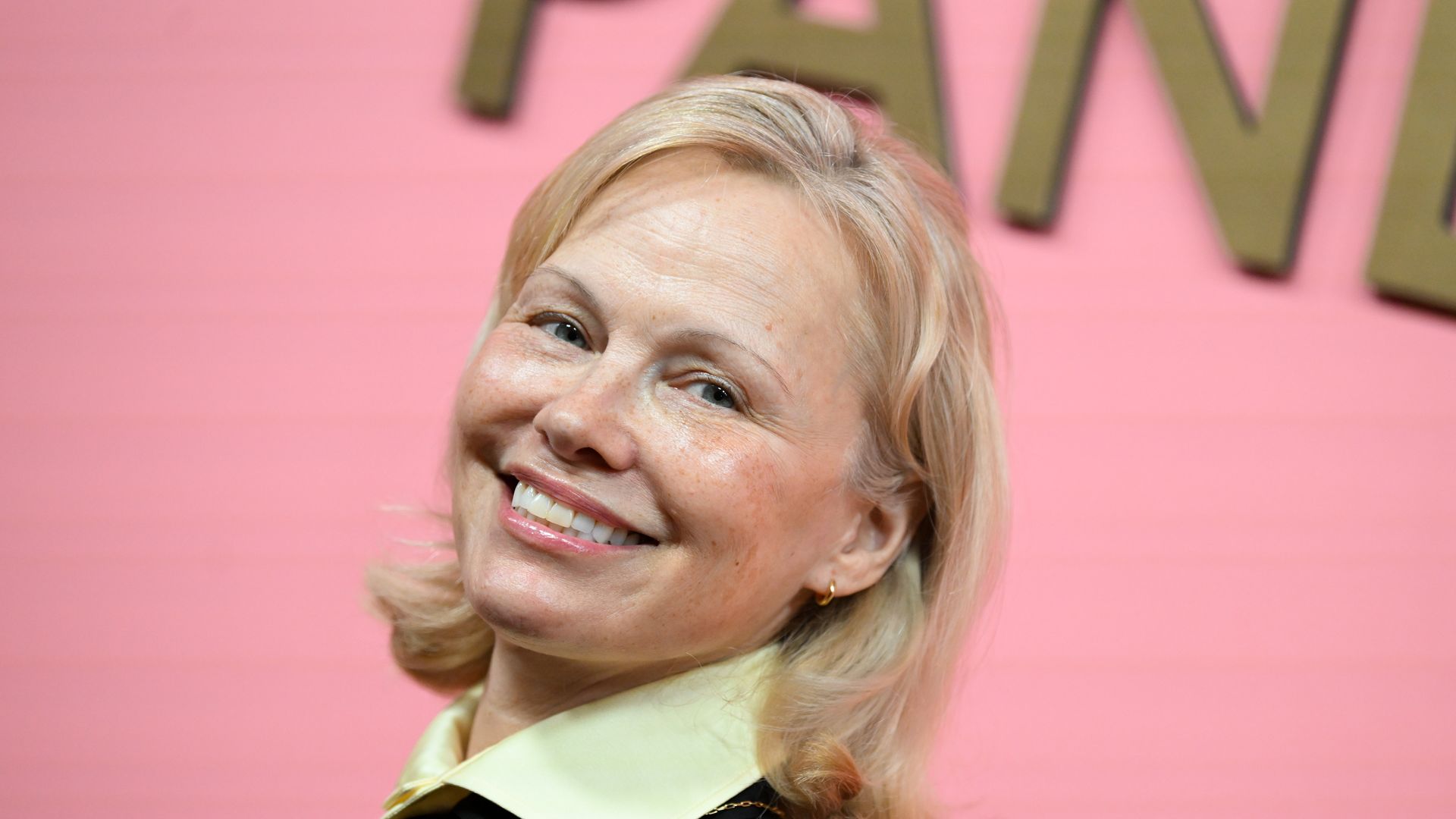 Pamela Anderson looks radiant at the pop-up launch for her new beauty brand