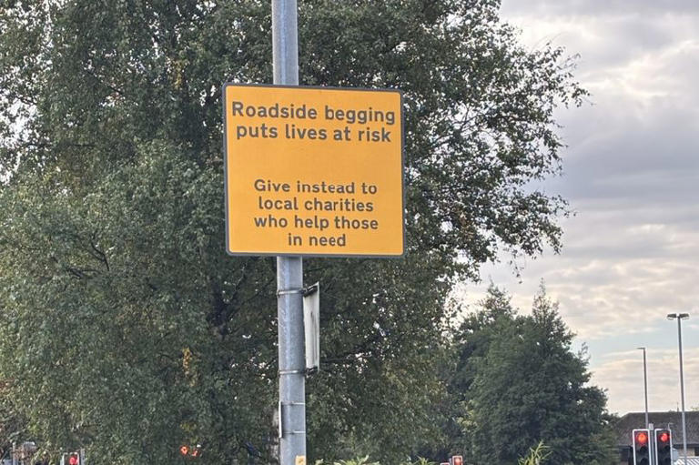 Council installs signs against begging at busy road junction
