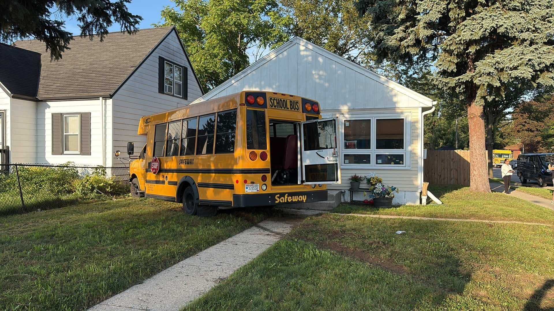 Hit-and-run driver crashes into school bus, damages Milwaukee home