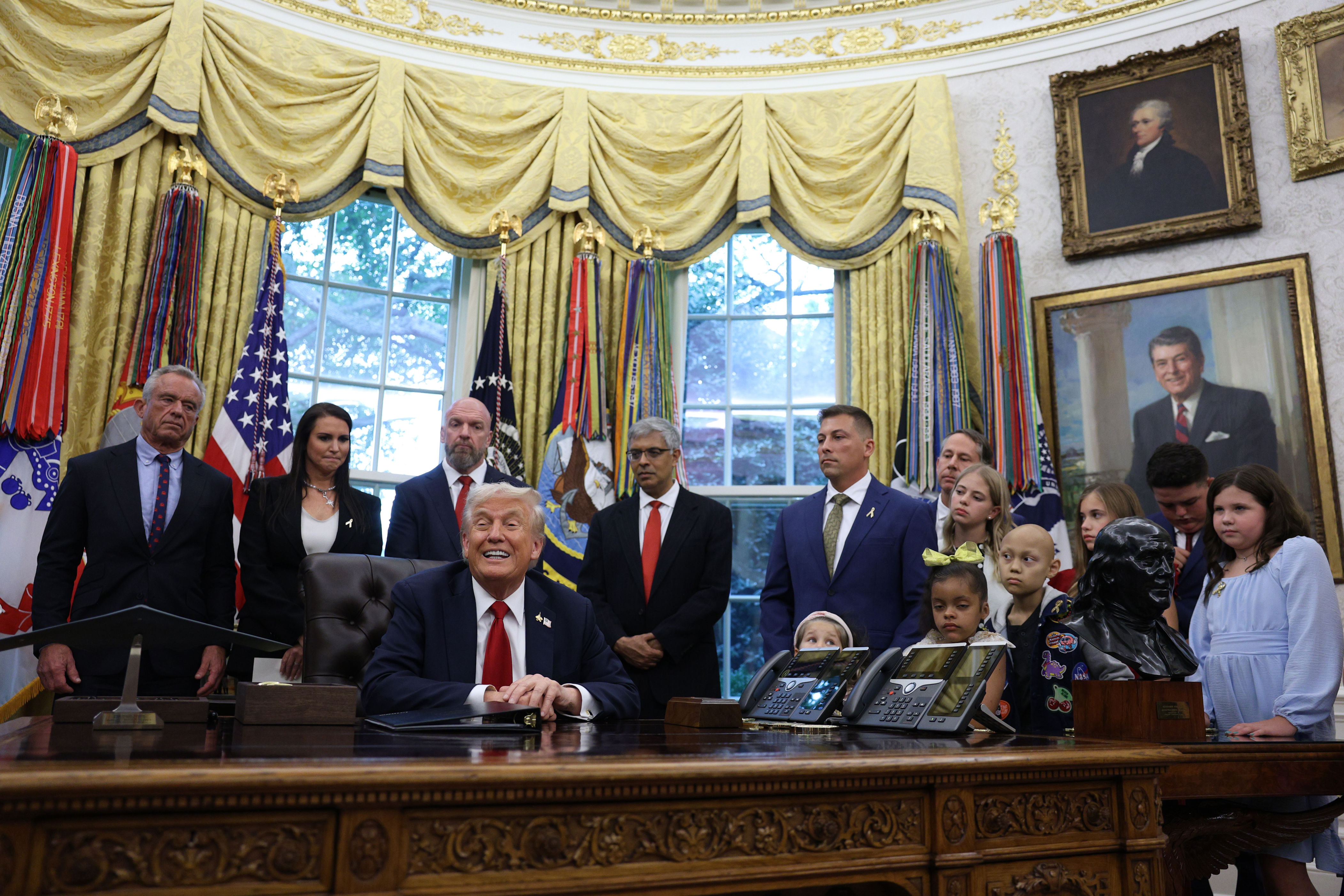 Trump says deal reached to end feud with Harvard