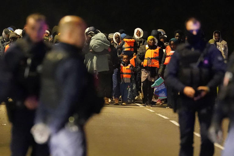 French riot police block dozens of migrants from reaching small boats ...