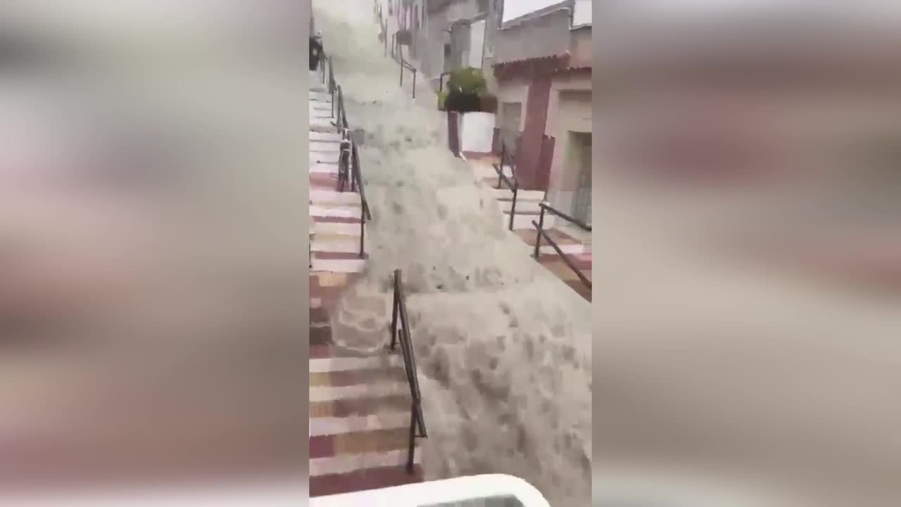 Valencia floods cascade down stairs as rain hits region