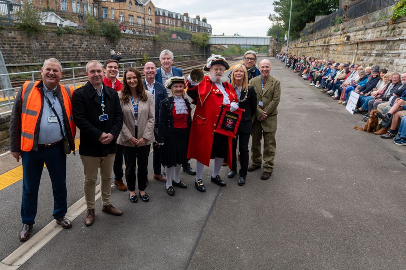 Seaside town visitors squeeze onto world's longest railway bench - all ...
