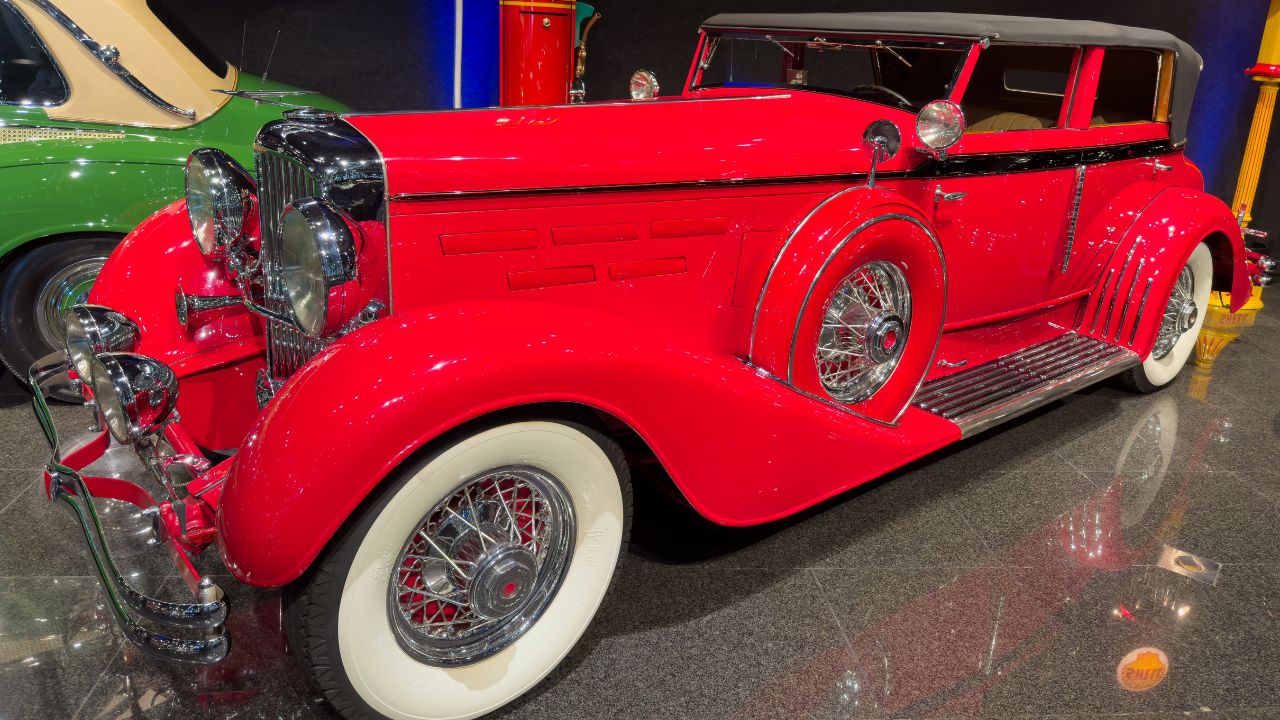 Why did old cars come with spotlights?