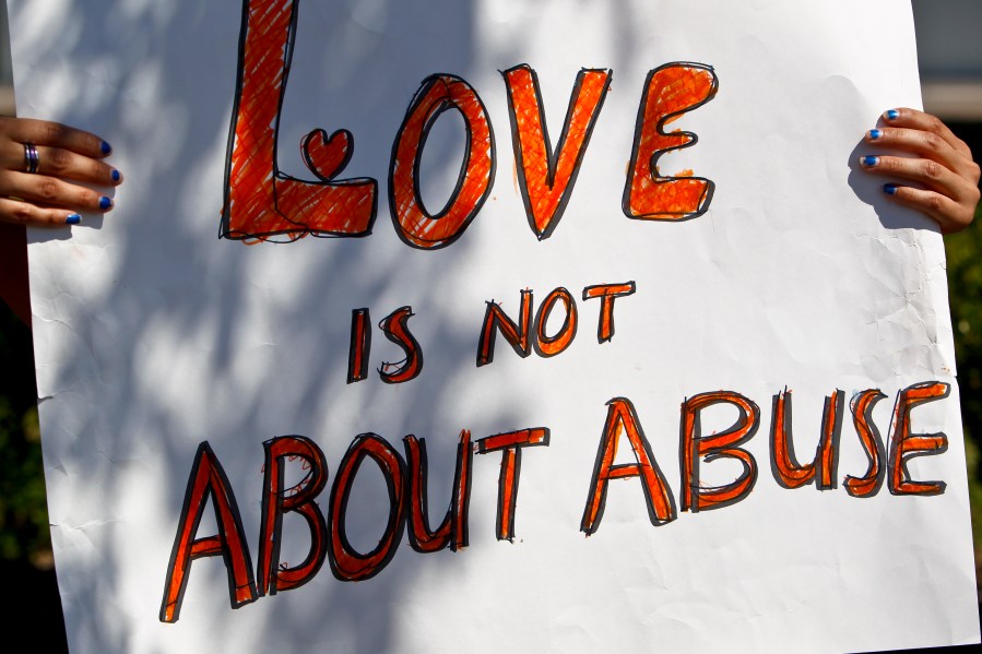 J Street adorned with banners for Domestic Violence Awareness Month