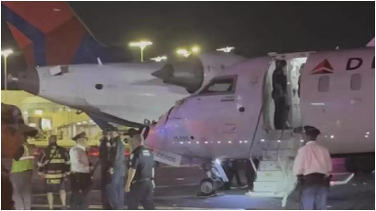Two Delta planes collide while taxiing at LaGuardia Airport in New York; wing of one plane ...