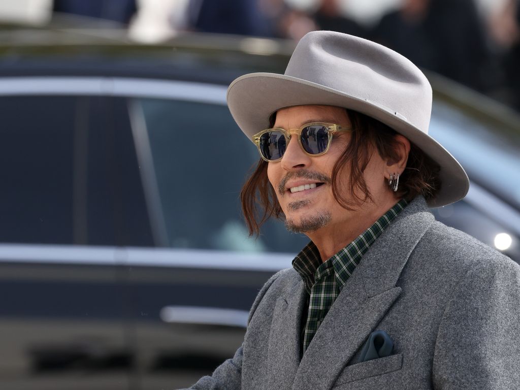 Johnny Depp is all smiles a year after an incredible teeth transformation