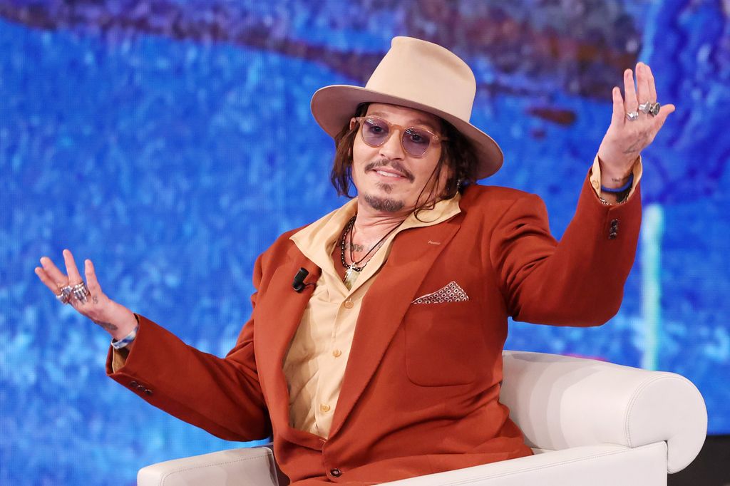 Johnny Depp is all smiles a year after an incredible teeth transformation