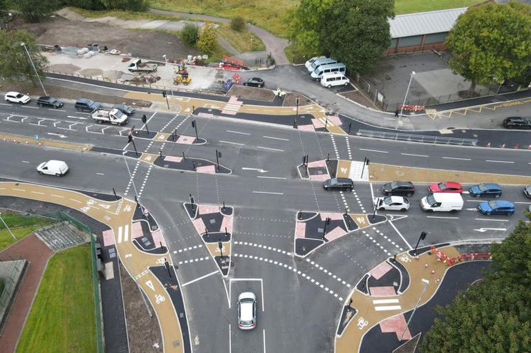 Controversial cycle lane along busy Greater Manchester route takes step ...