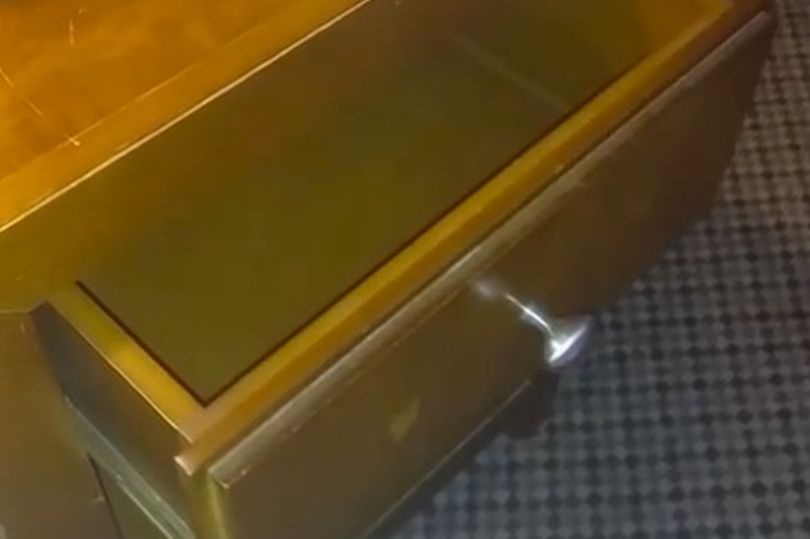 Man films ghost opening drawer and throwing iron in haunted hotel room