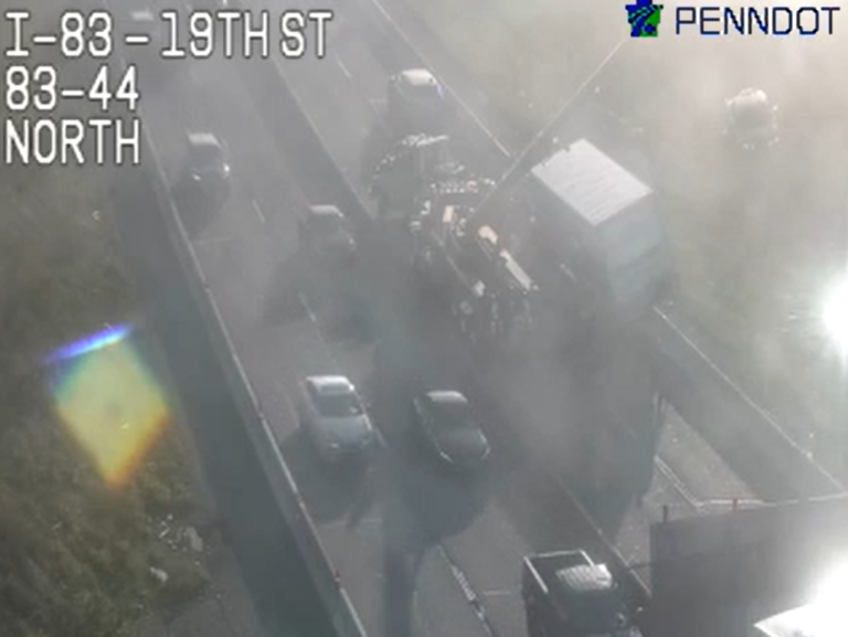 Box truck crashes onto concrete barrier along I-83