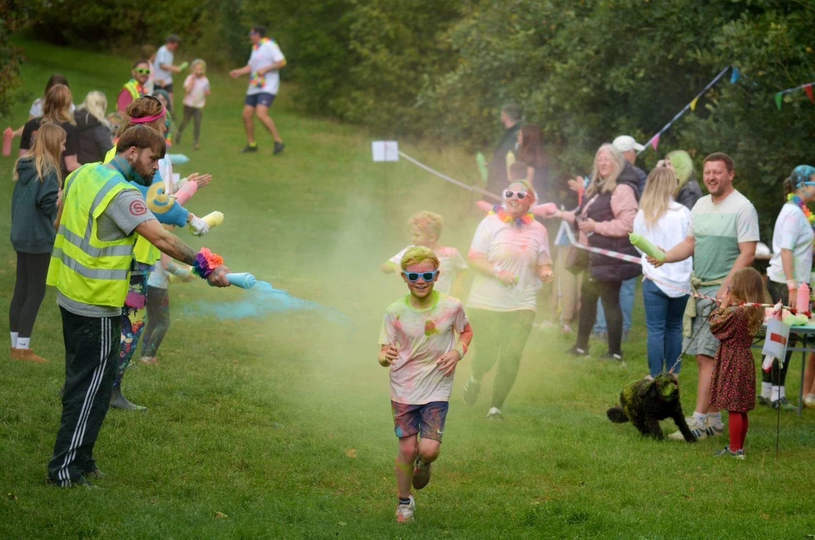 In pictures: More than 60 children and parents complete colour run to ...
