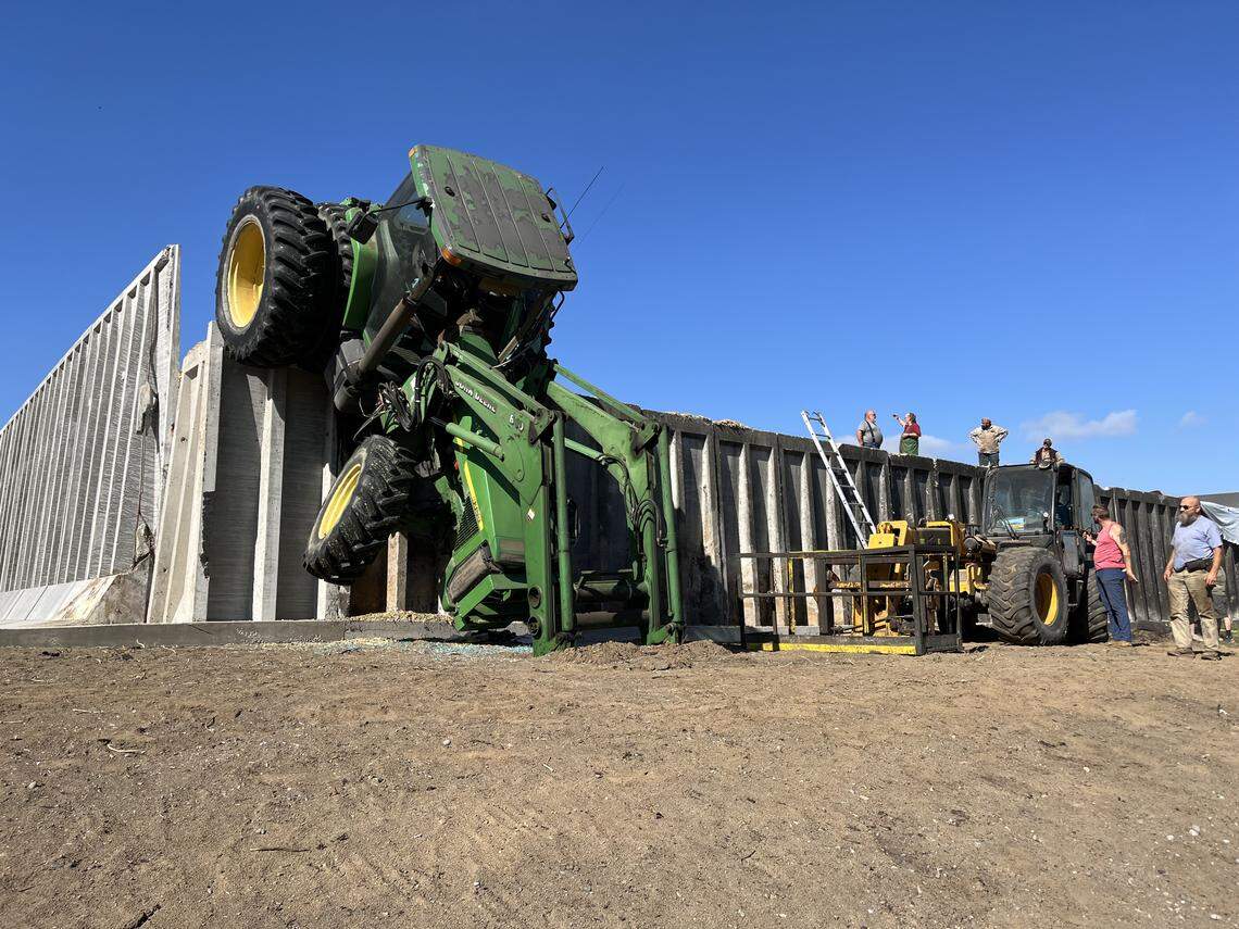 Firefighters, farm workers rescue tractor operator after 12-foot fall ...
