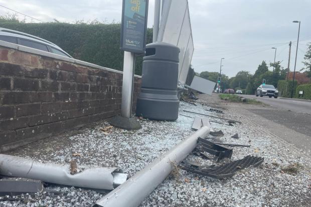 Woman charged after bus stop destroyed in late-night crash