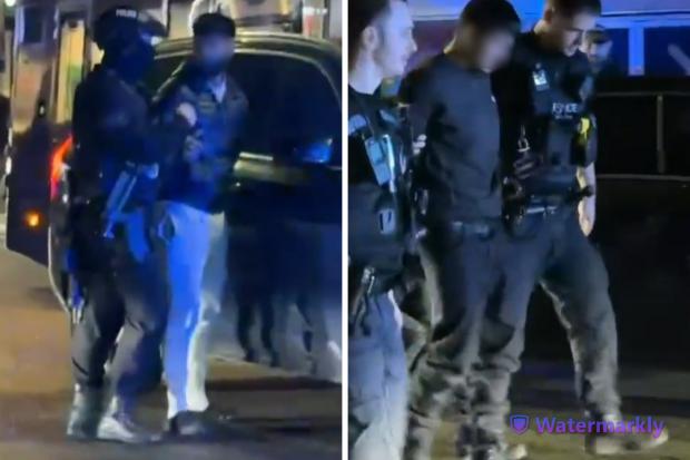Armed police storm road and 'make arrests' as helicopter sent up