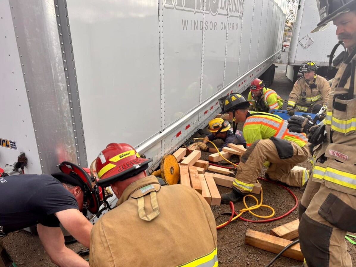 Sparks firefighters save person trapped under truck trailer