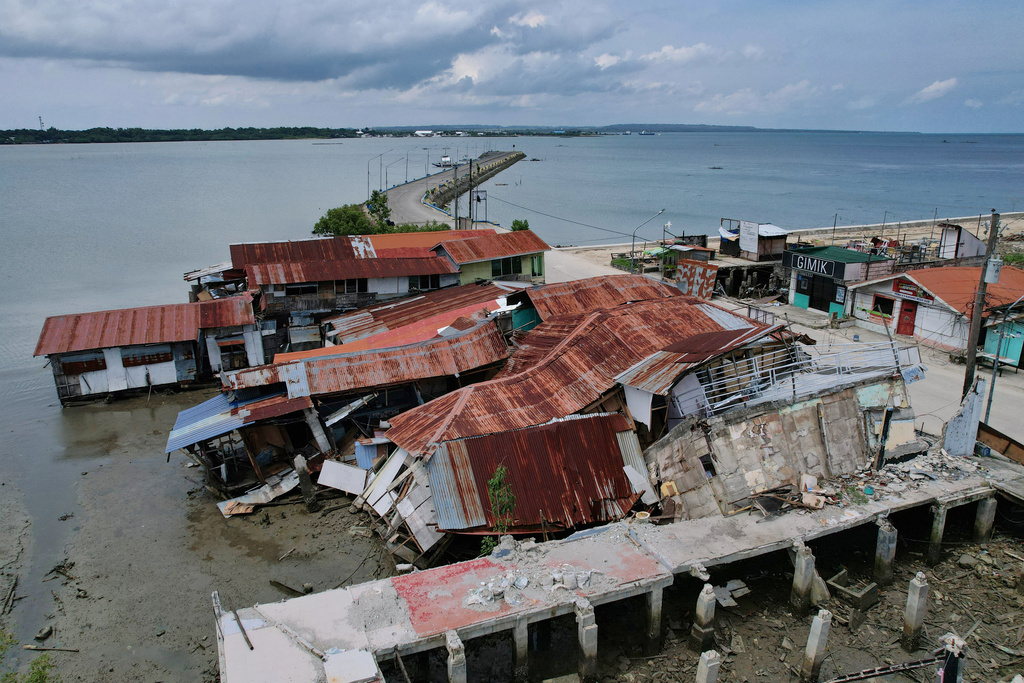 Matmo weakens into a storm after blowing across northern Philippines