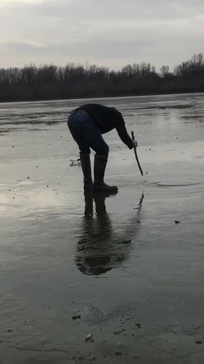 Guy Falls in Frozen Water as Ice on Surface Breaks