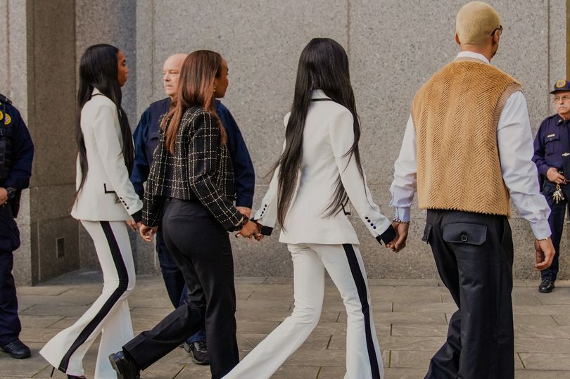 Diddy's family forms 'unbreakable line' in 'somber' display as they ...