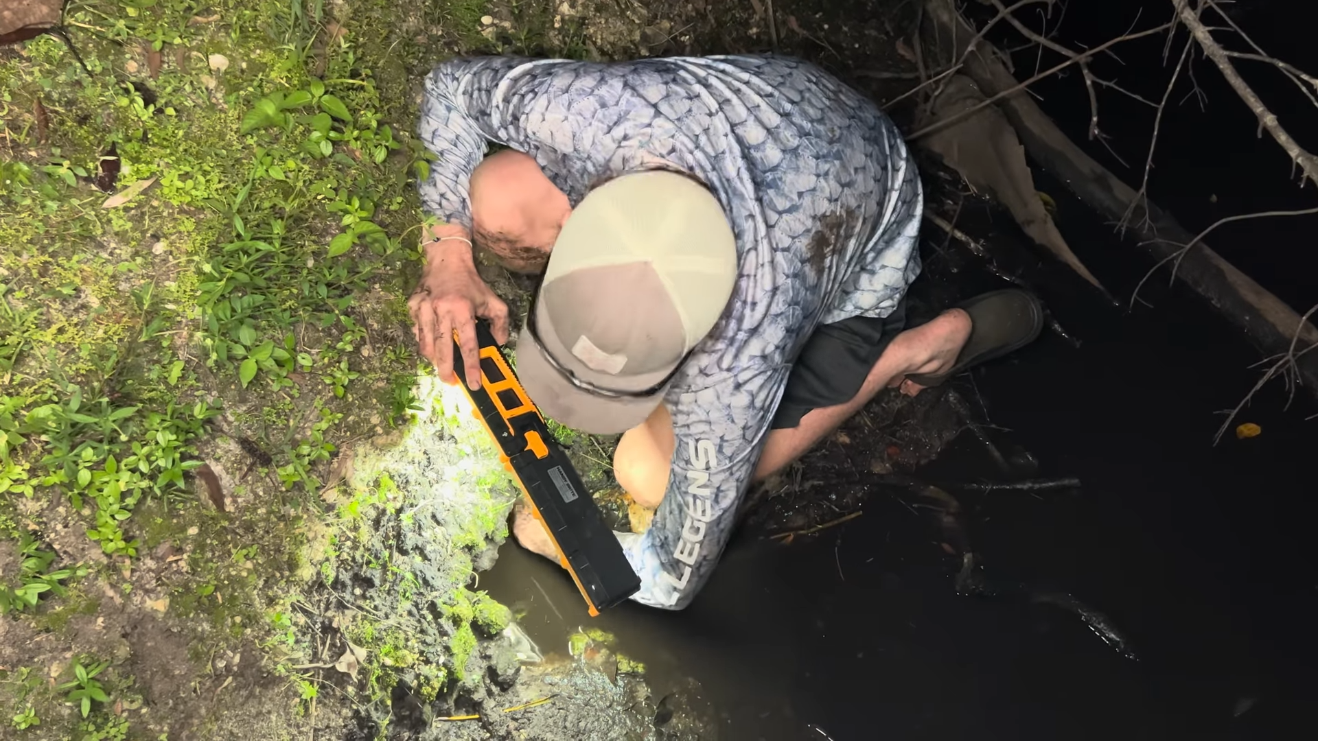 How One Man Risks His Hands by Fishing Eels Out of Mud Holes