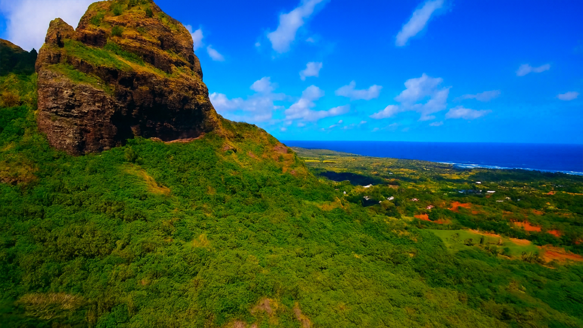 Majestic Green Mountains Overlooking the Blue Ocean 4K