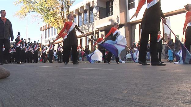 What roads will be closed for the Festival of Bands parade?