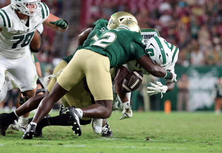 USF downs Charlotte 54-26 in a wild conference opener