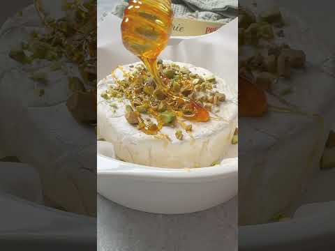 Super easy baked brie drenched in hot honey & pistachio