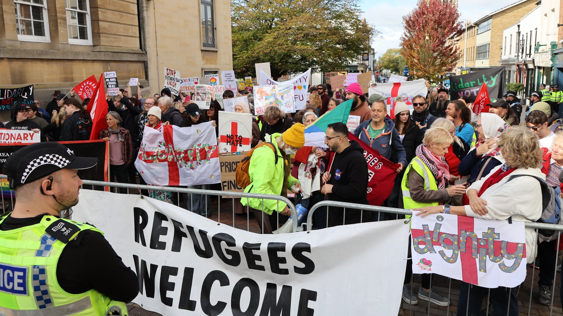 Anti-migrant protesters and counter-demonstrators face off in Gloucester