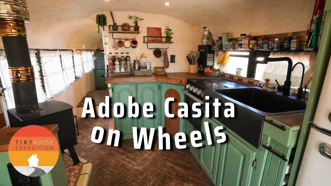 Couple builds adobe style tiny home skoolie for digital nomad life