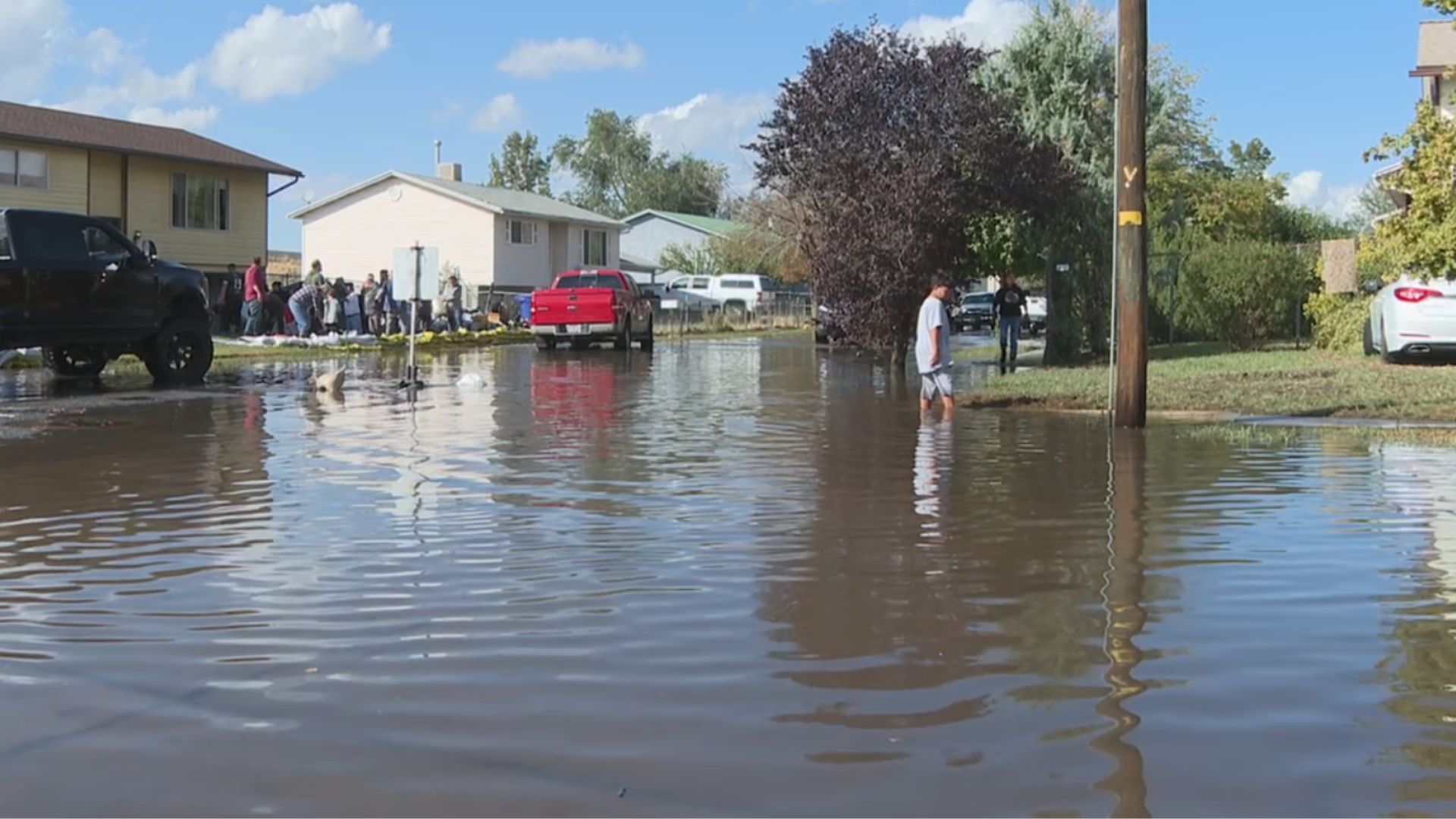 Residents come together to help clean up after damaging floods in Salt Lake