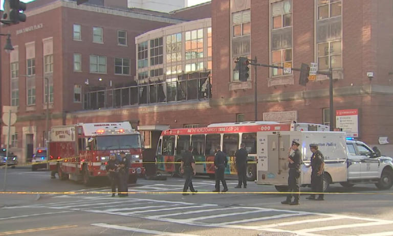 Pedestrian struck, trapped under bus in Boston