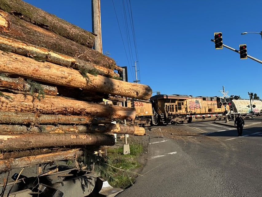 Train crashes into log truck stuck on tracks near Canby