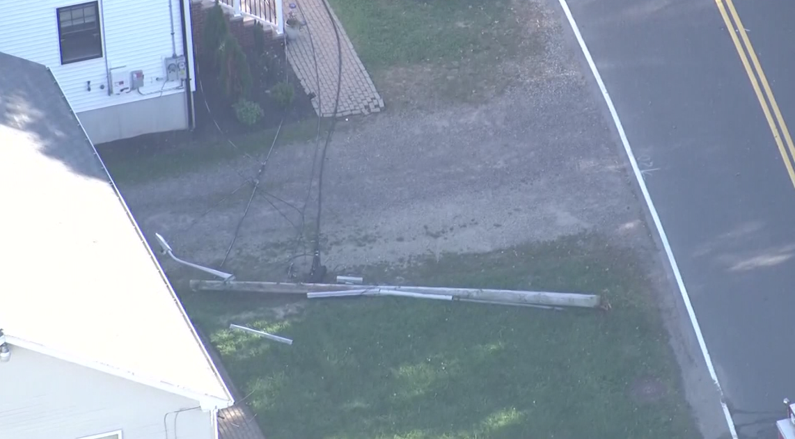2 utility poles down on Medford street, shutting off power to nearby homes