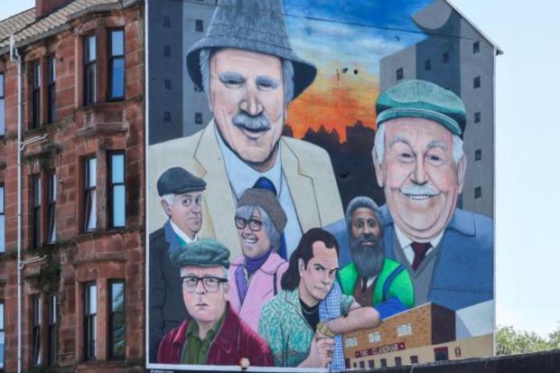 Still Game stars pictured posing with 'belter' mural honouring the show