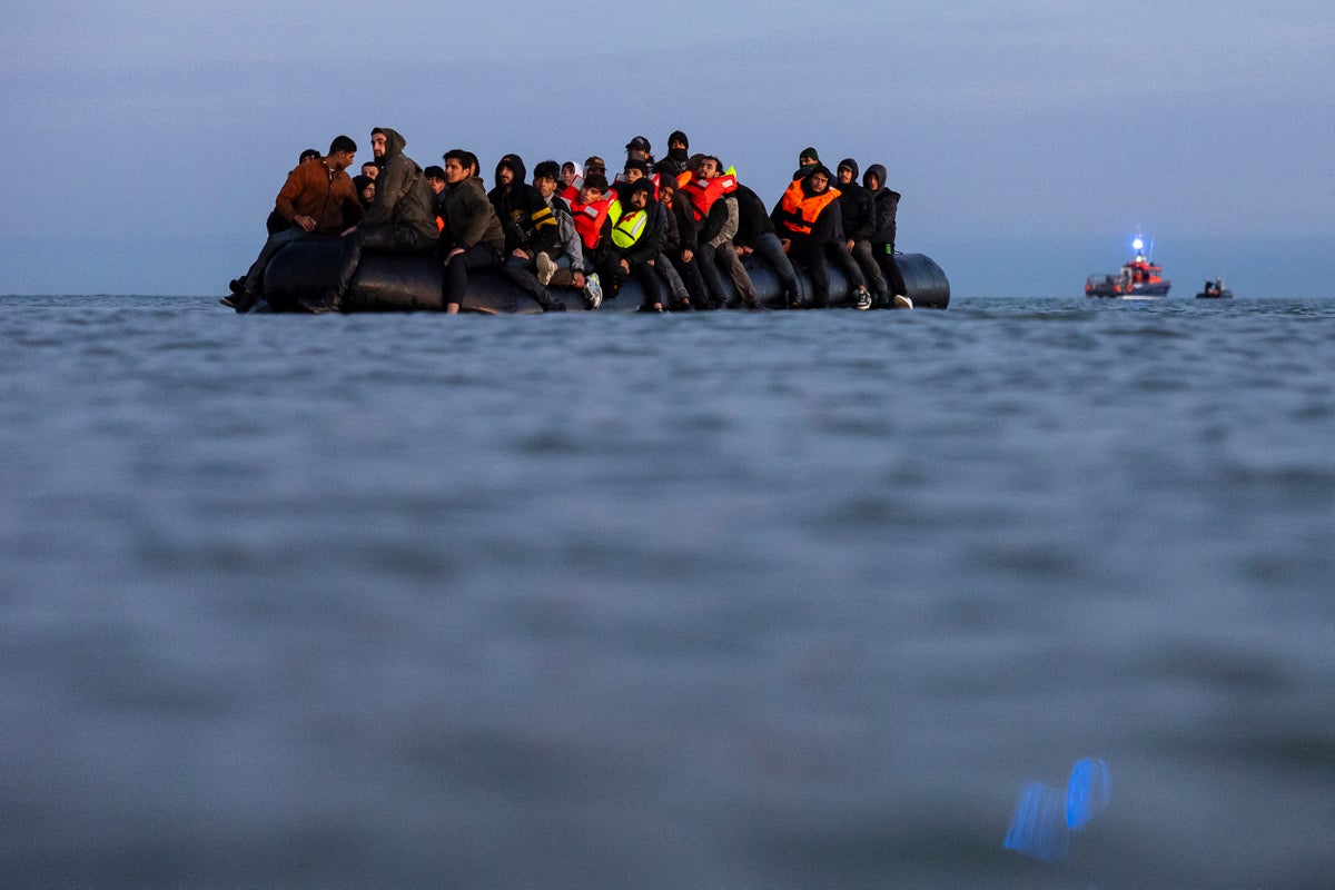 Family of three become first asylum seekers to arrive in UK as part of ...