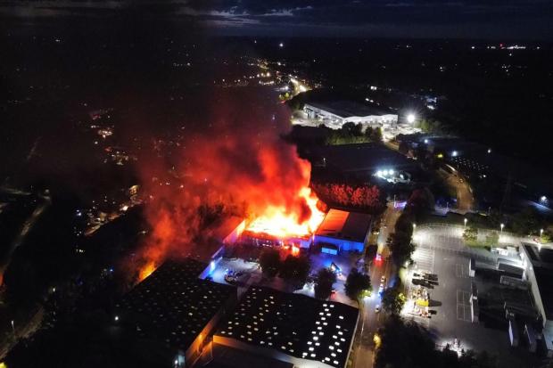 Search and rescue team on standby as fire rages after massive explosion