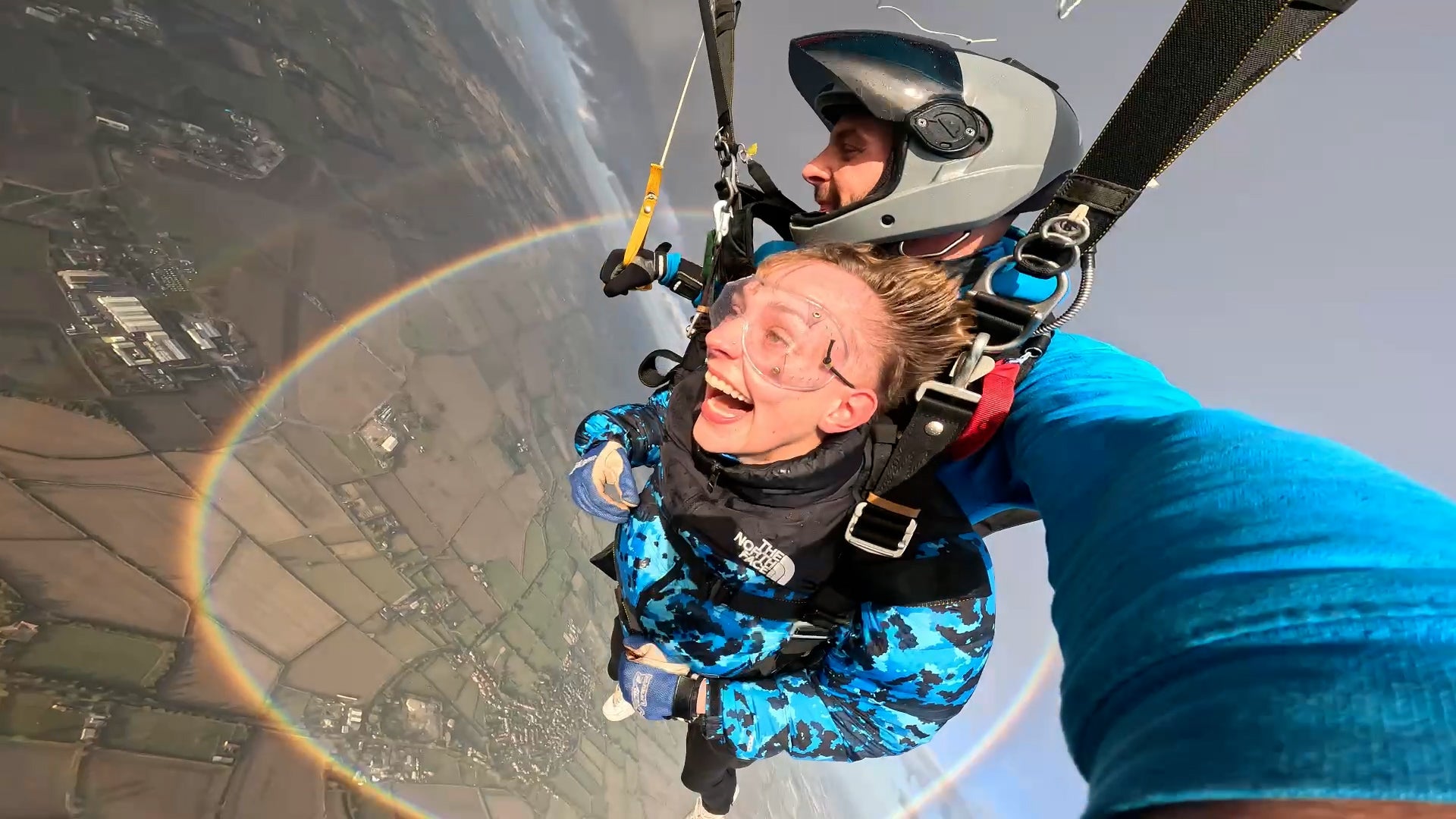 Skydivers capture circle rainbow over England