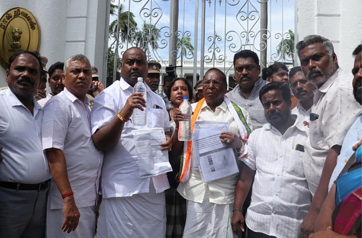 Former CM Narayanasamy leads dharna before Raj Nivas over water ...