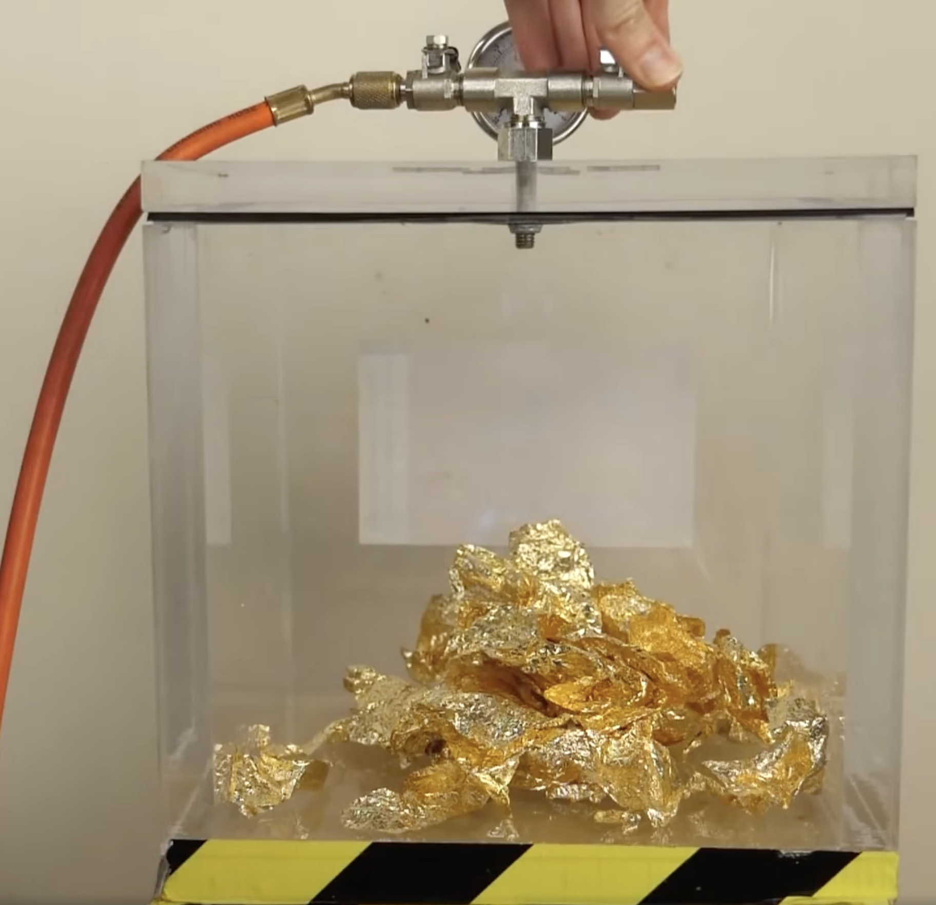 Gold Japanese foil ball in a vacuum