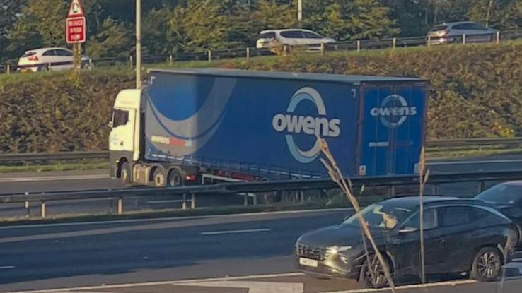 M60 delays after lorry hits central reservation