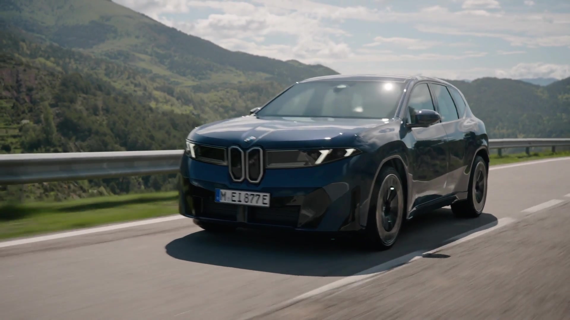 The new BMW iX350 xDrive in Ocean Wave Blue Driving Video