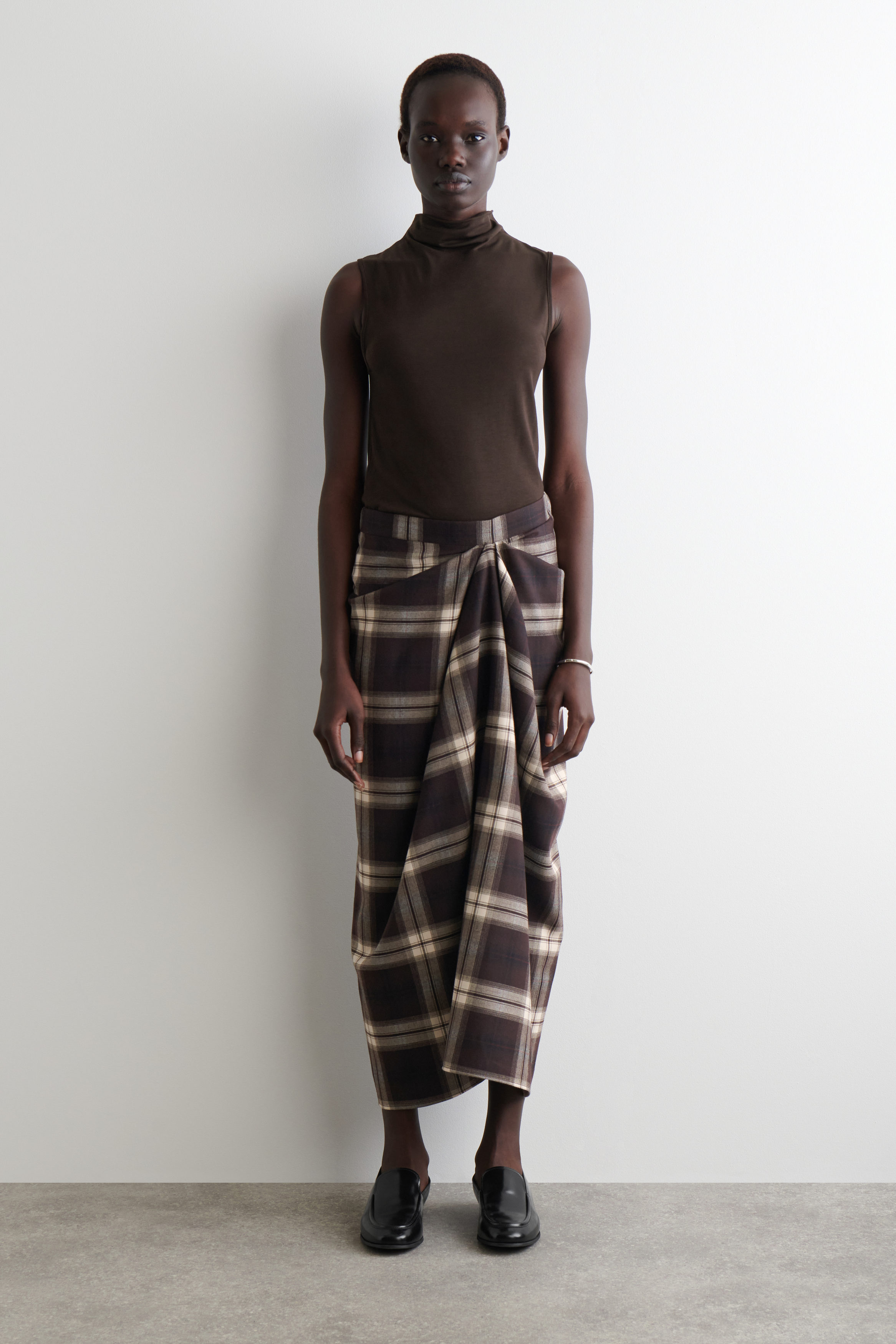 It's Time to Retire Your Summer Skirts—Plaid Midis are Our Autumn Essential