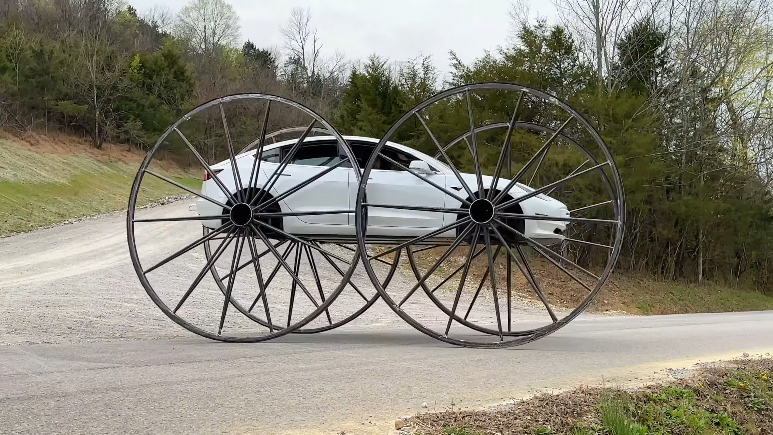 Driving a Tesla Upside Down on 10ft Wheels