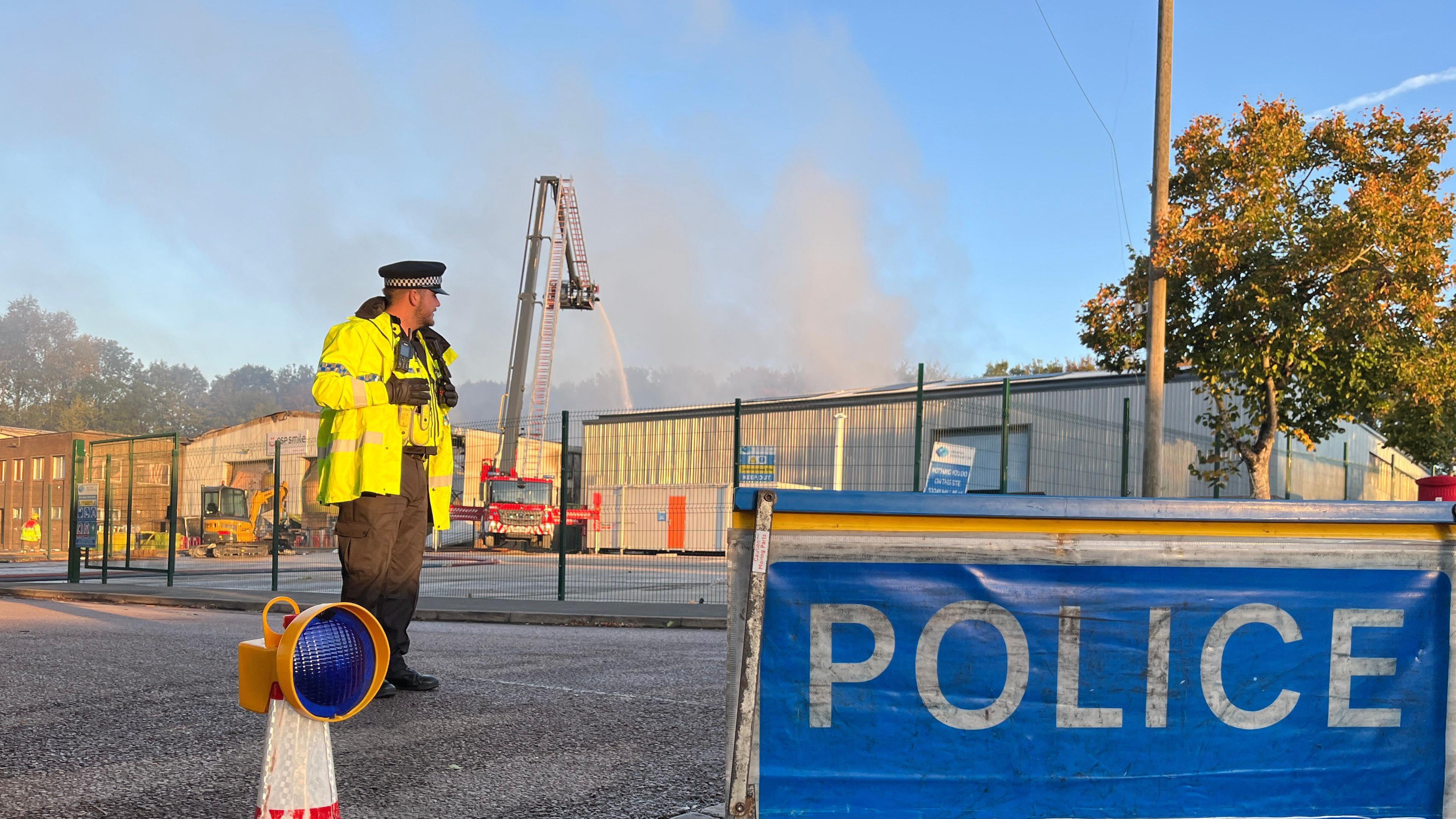 Fire crews extinguishing hotspots at explosion site